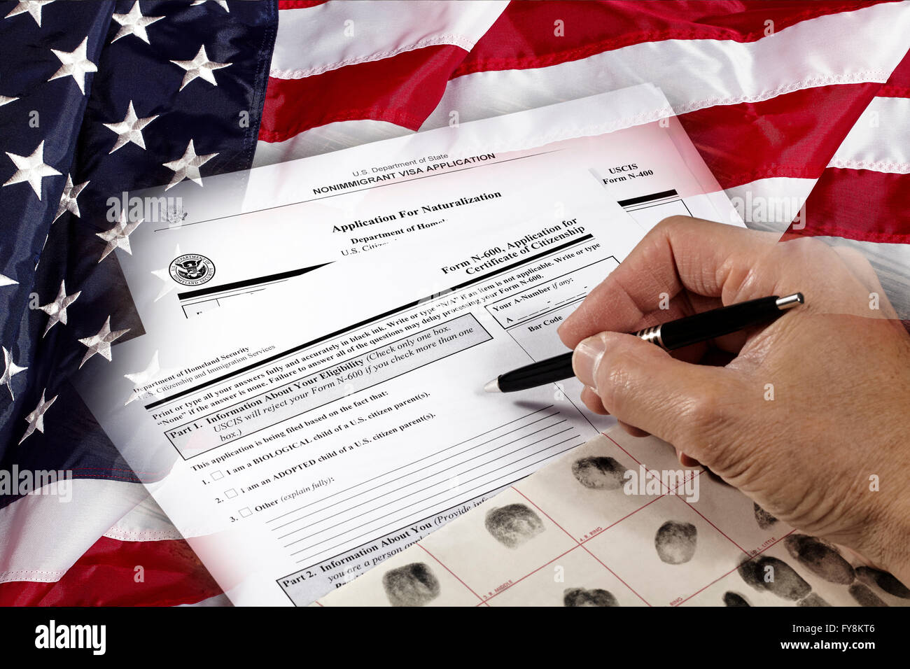 Man with American citizenship application on USA flag concept ...