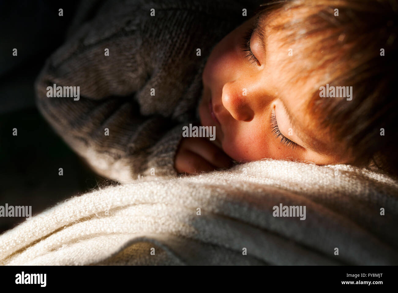 Little boy sleeping on the couch Stock Photo - Alamy