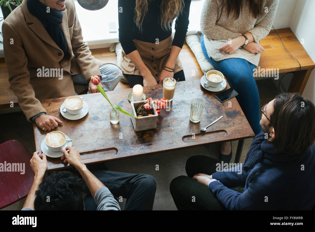 Friends meeting in a cafe Stock Photo - Alamy