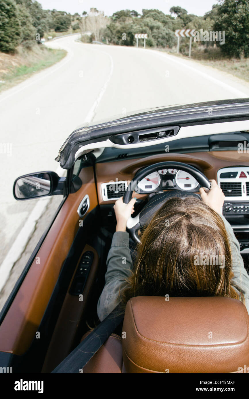 Woman driving a convertible car Stock Photo - Alamy