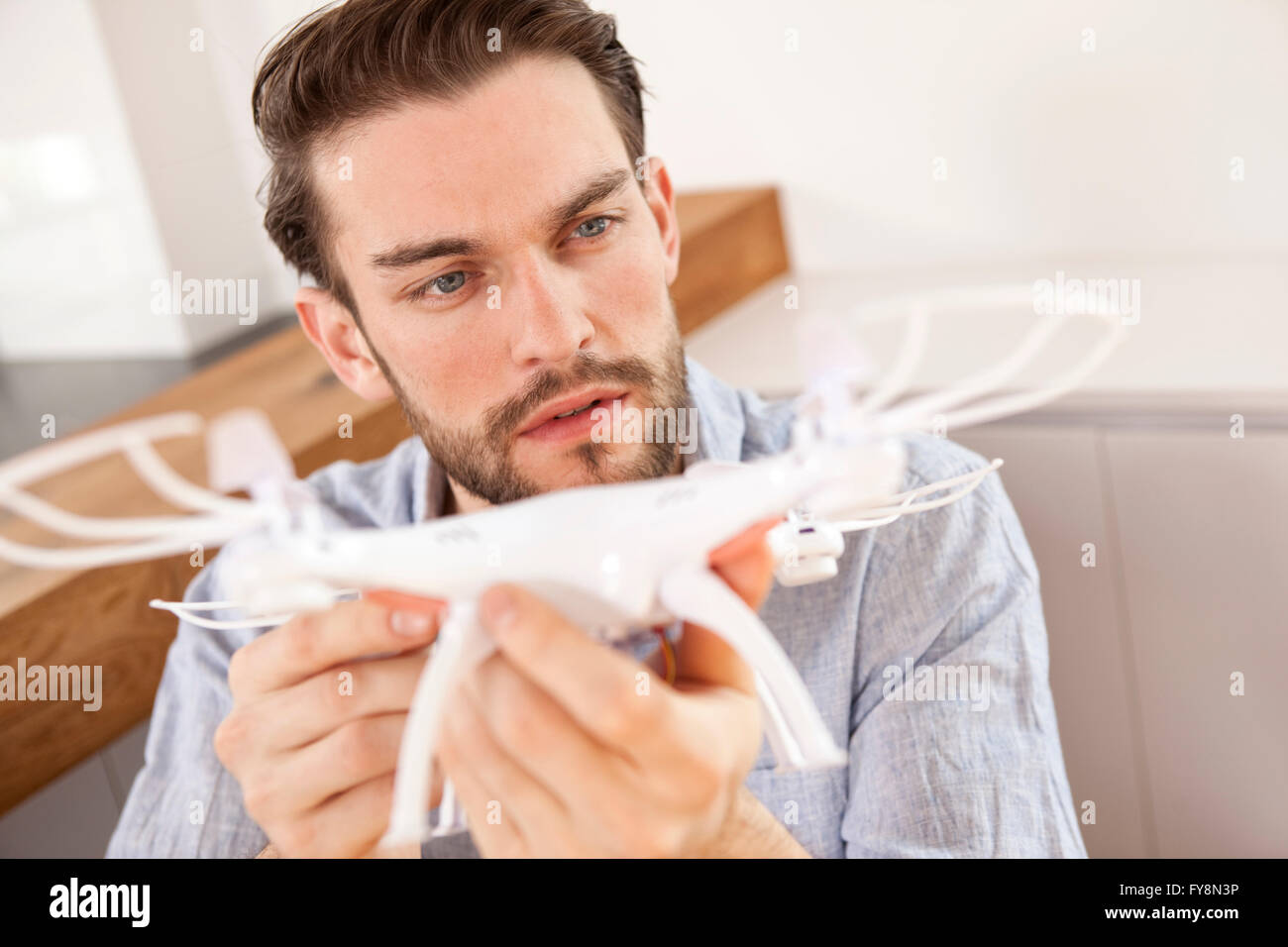 Portrait of young man with drone Stock Photo - Alamy