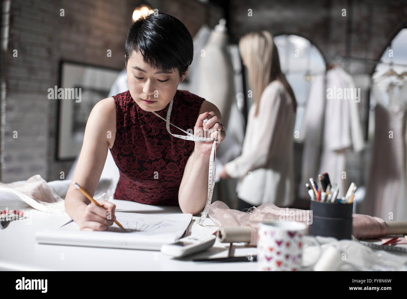 Wedding dress designer working Stock Photo - Alamy