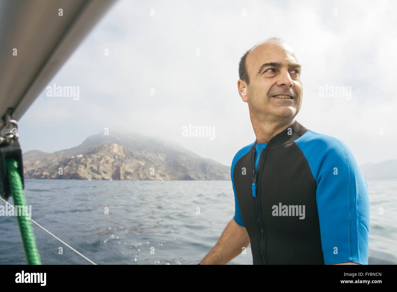 Man sailing with his sailboat at sea Stock Photo - Alamy
