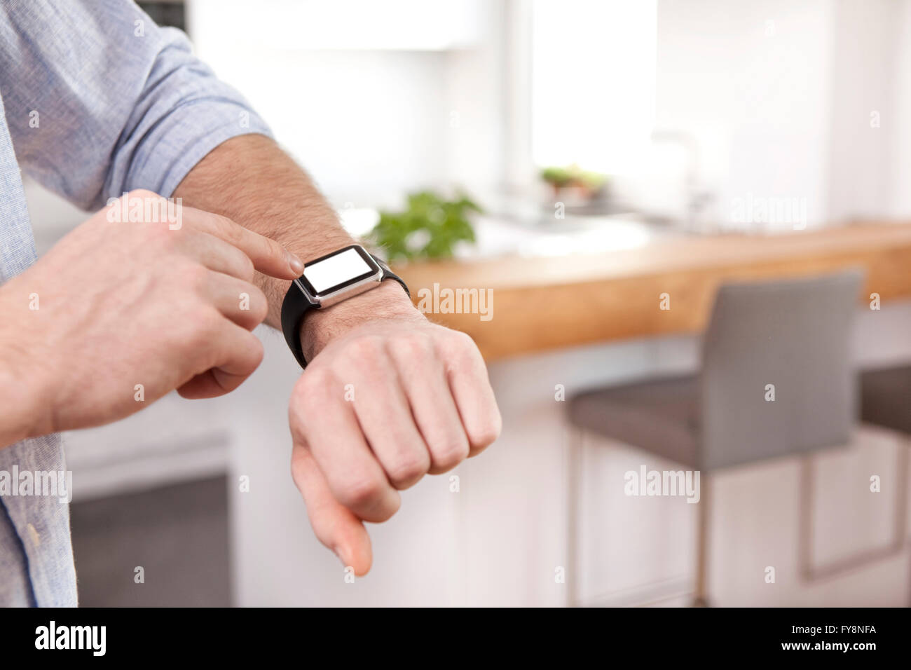 Man using his smartwatch Stock Photo - Alamy