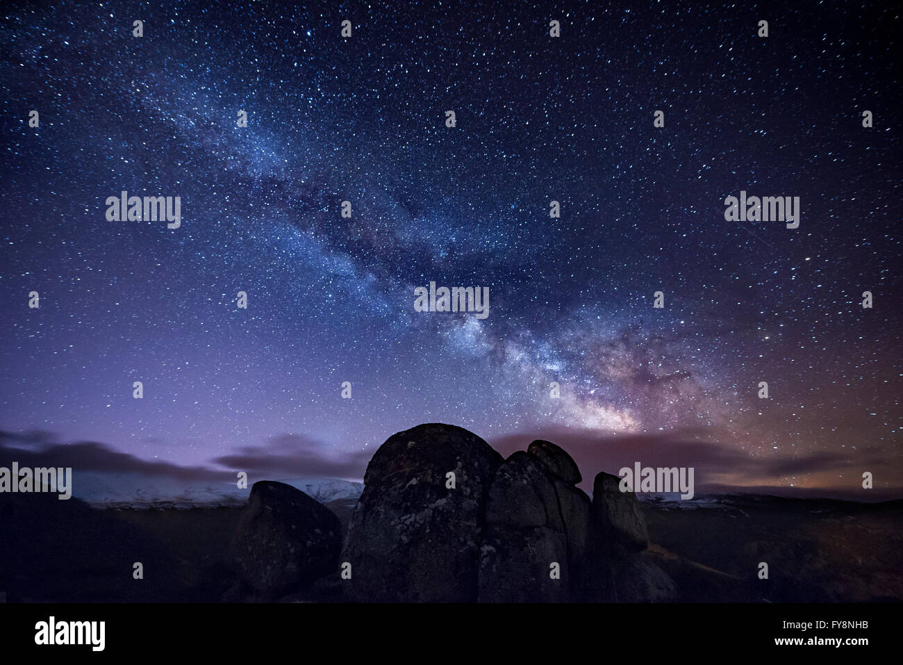 Milky way over ancient granite rocks Stock Photo - Alamy