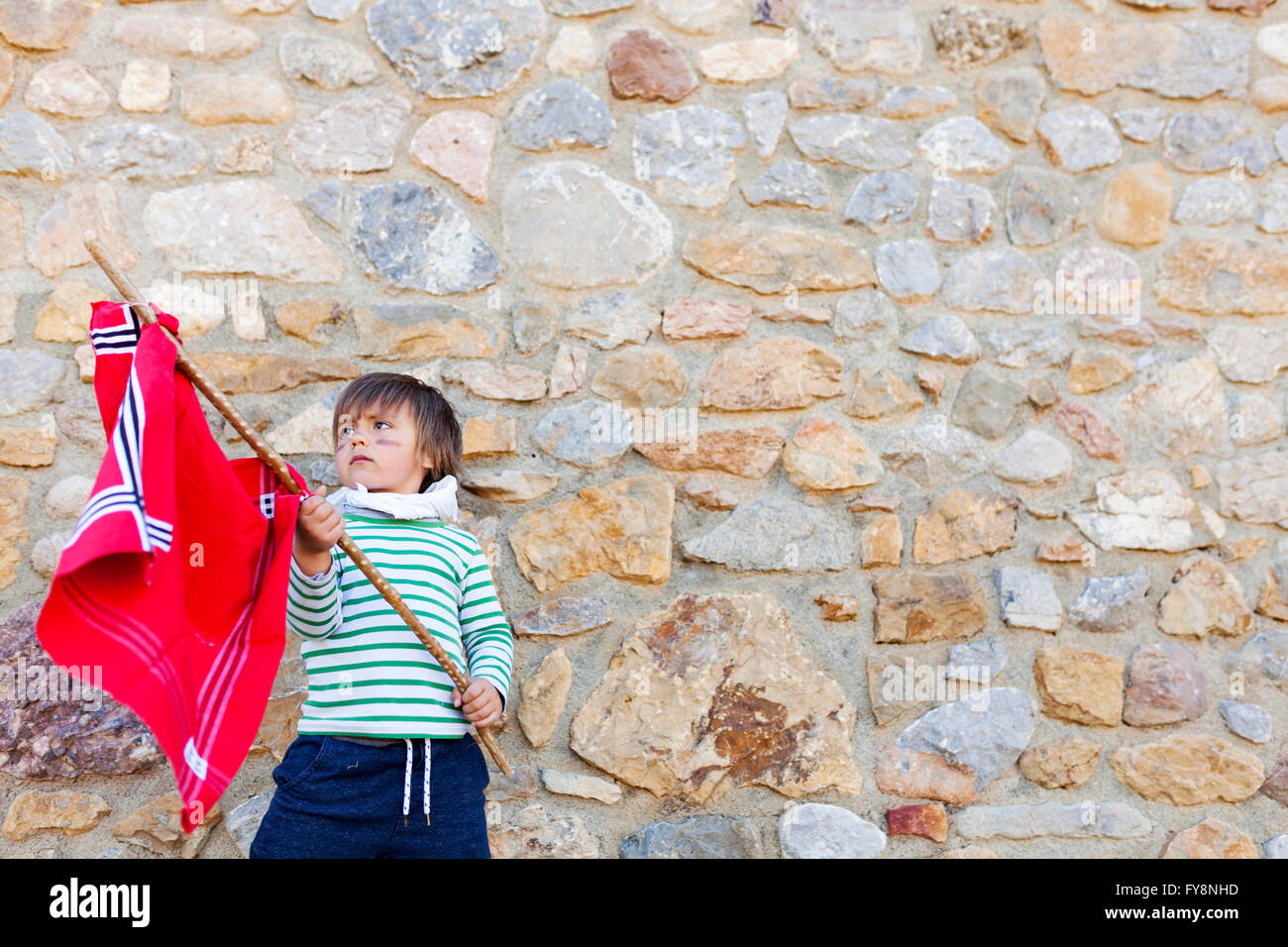 Portrait of little boy with red flag playing hero Stock Photo - Alamy