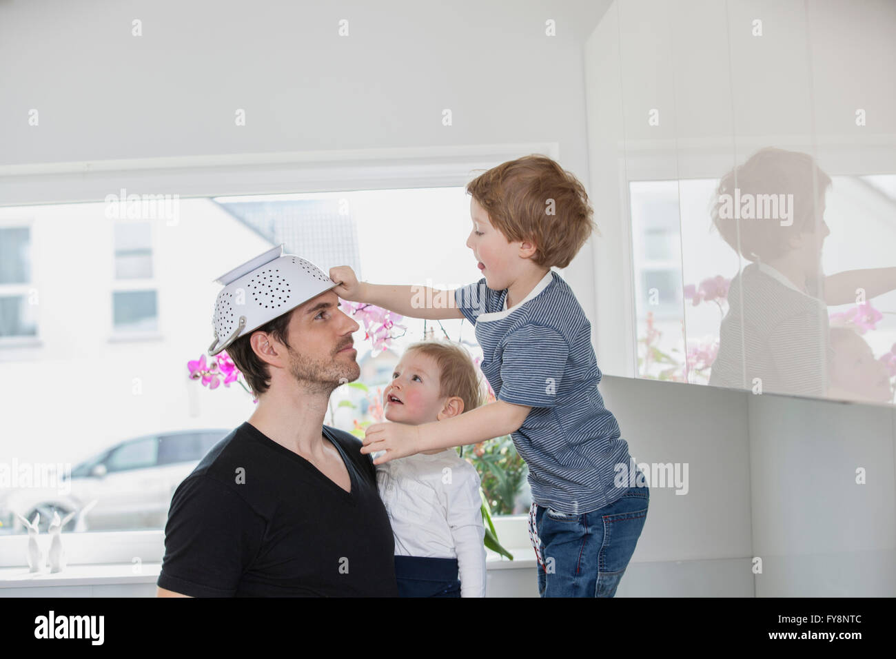 Using colander as hat hi-res stock photography and images - Alamy