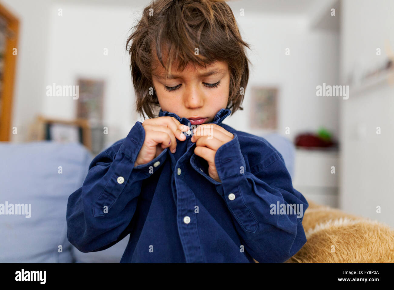 Boy Buttoning Shirt High Resolution Stock Photography and Images - Alamy