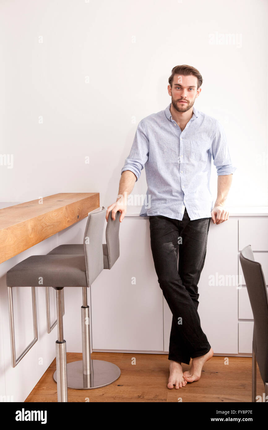Portrait of young man at home Stock Photo - Alamy