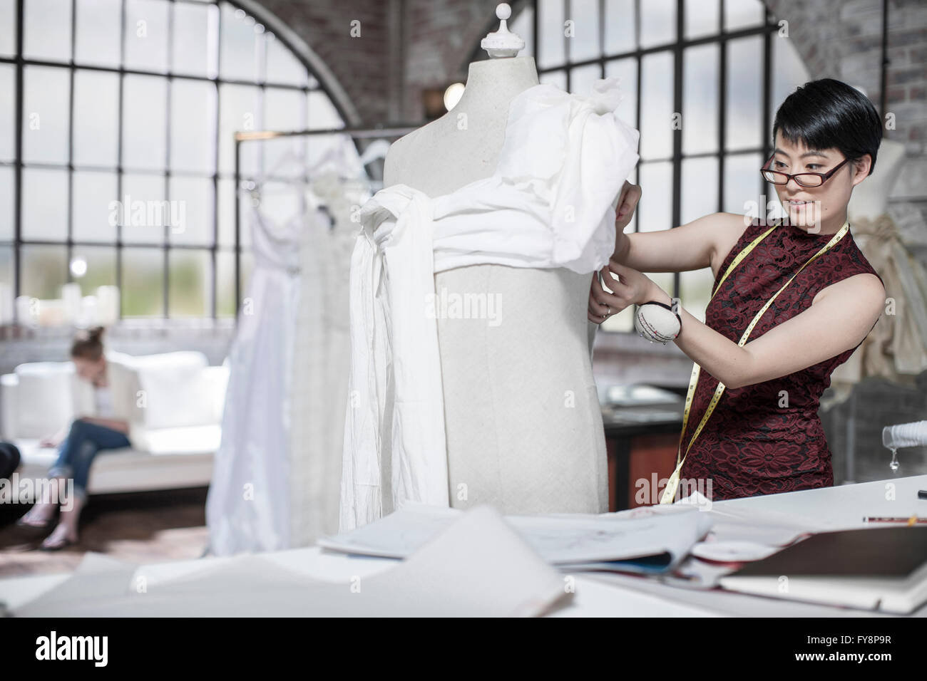 Wedding dress designer working, dress form Stock Photo - Alamy