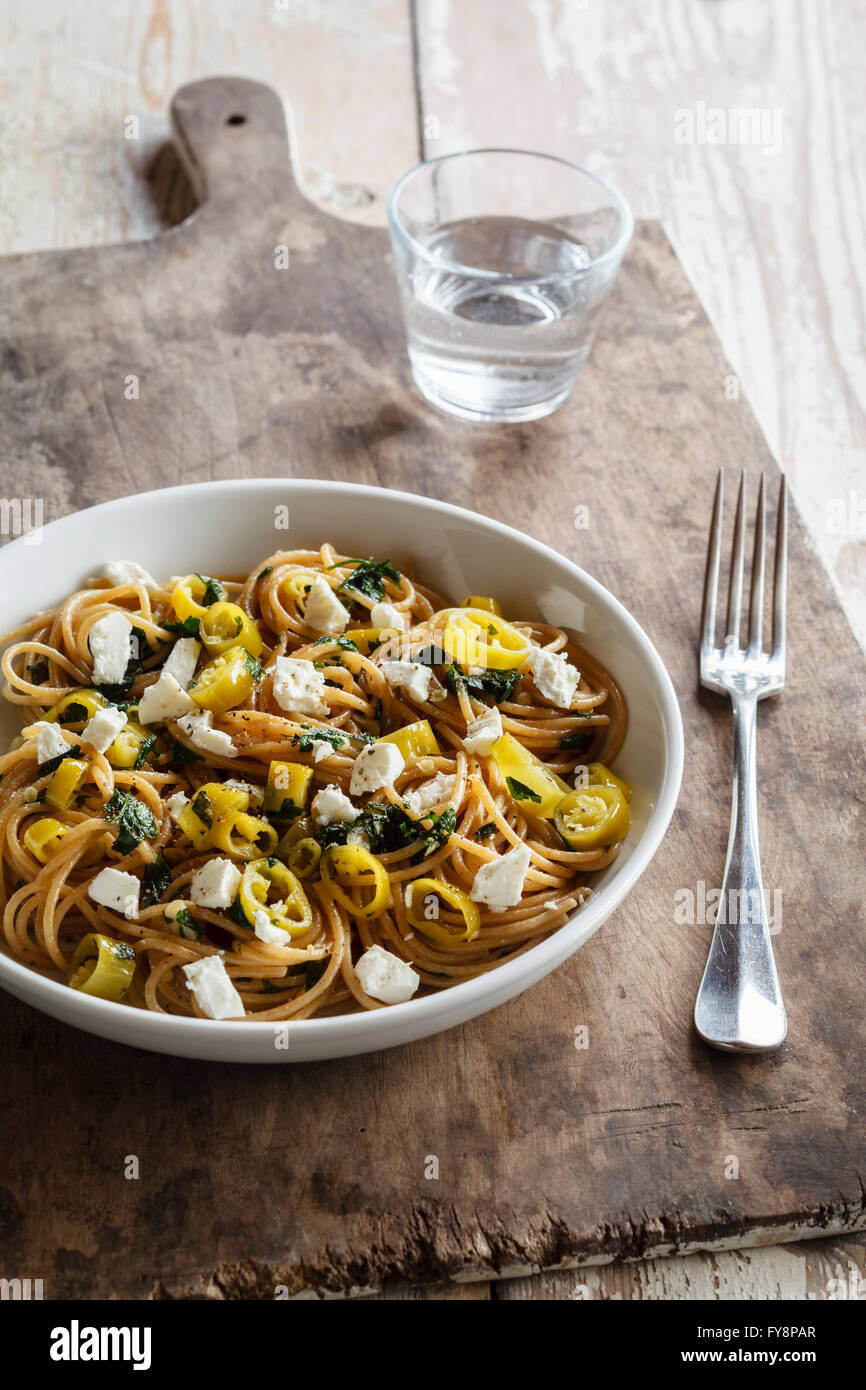 Plate of spelt whole grain spaghetti with feta and chili peppers Stock ...