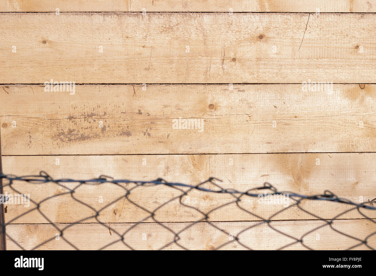 Mesh wire fence and wood Stock Photo - Alamy