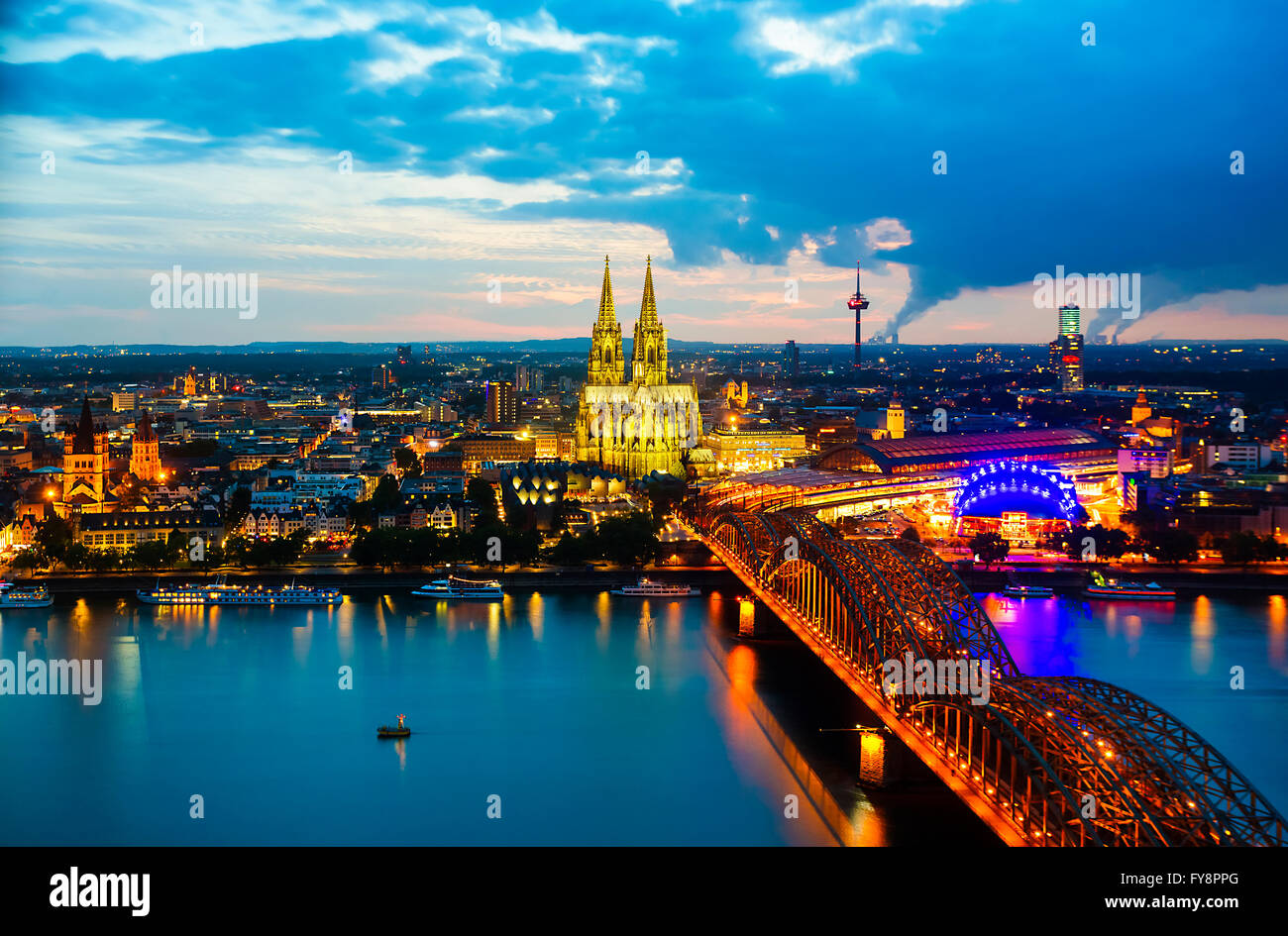Germany, Cologne, view to lighted cityscape with Cologne Cathedral and ...