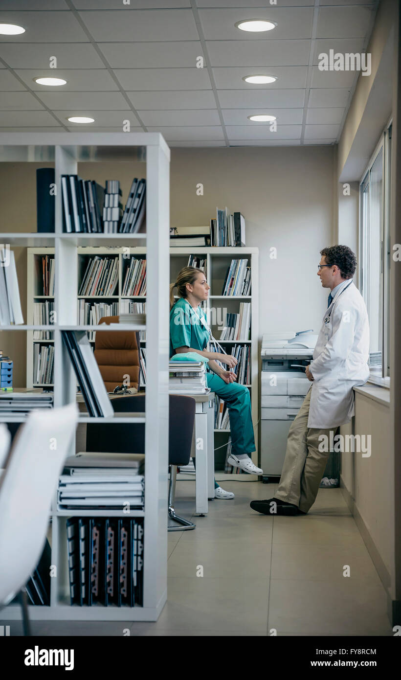 Two doctors talking in medical office Stock Photo - Alamy