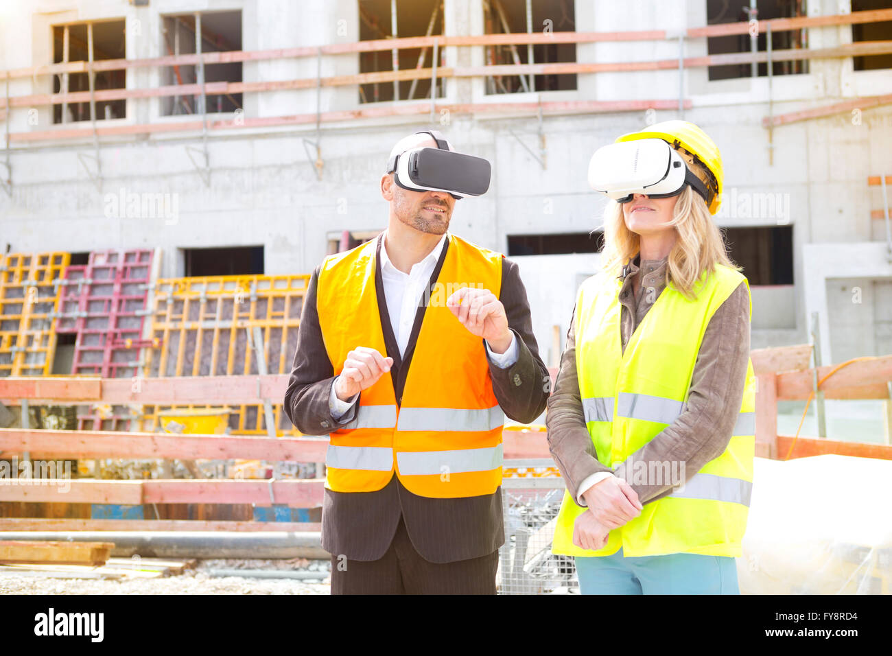 Two persons with Virtual Reality Glasses at construction site Stock ...