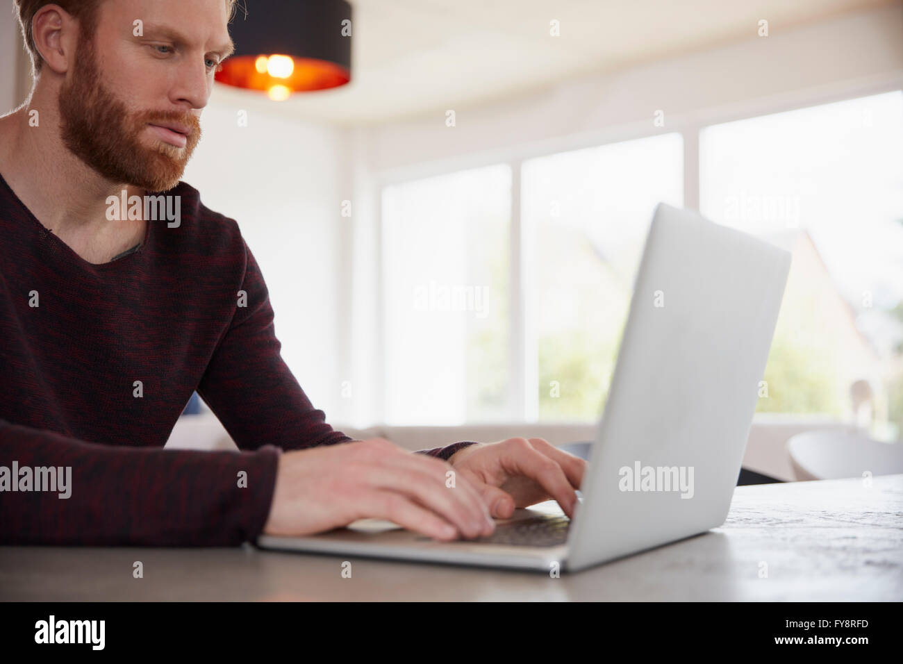 Man home using laptop hi-res stock photography and images - Alamy