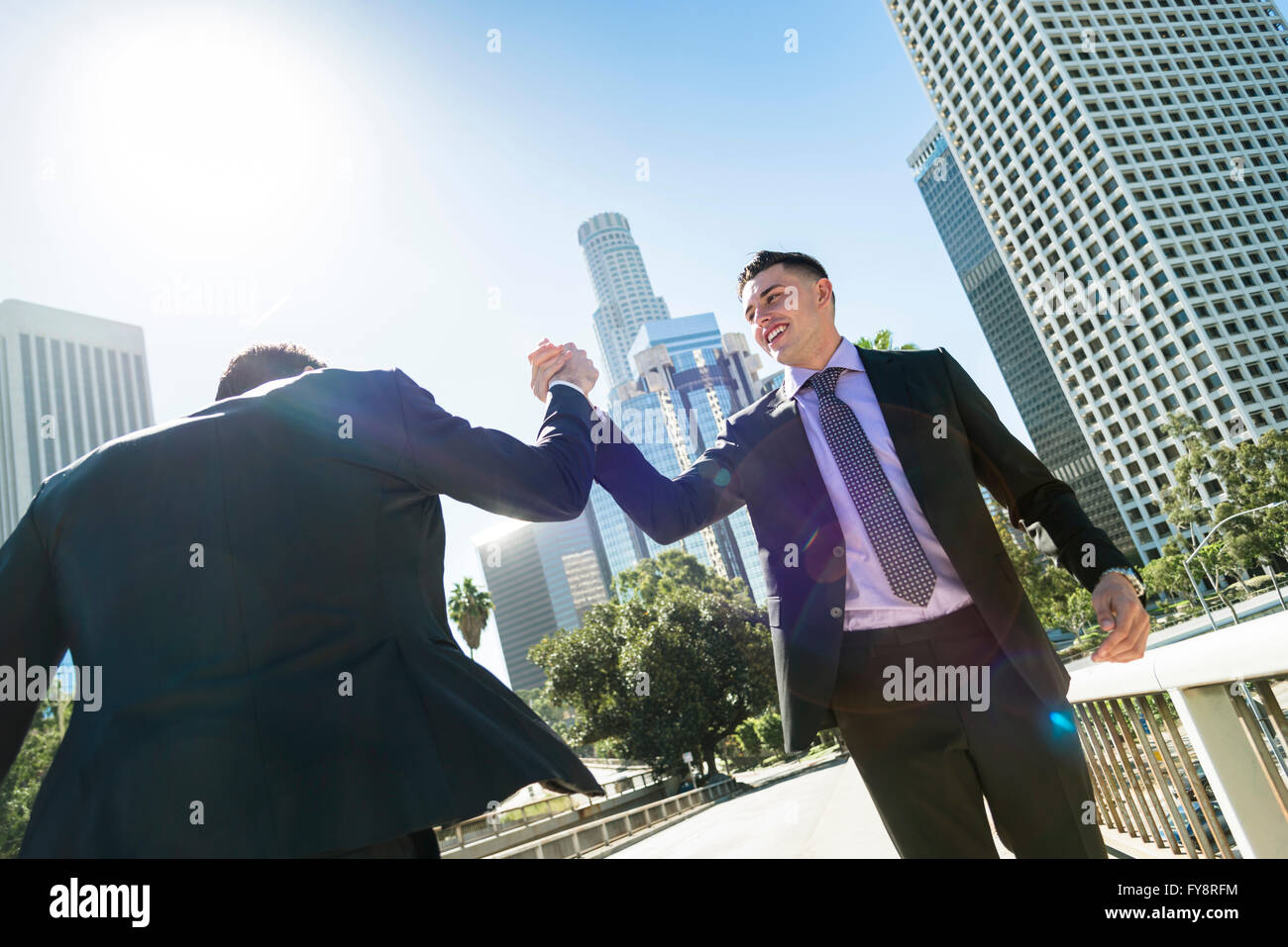 USA, Los Angeles, two businessmen high fiving Stock Photo - Alamy