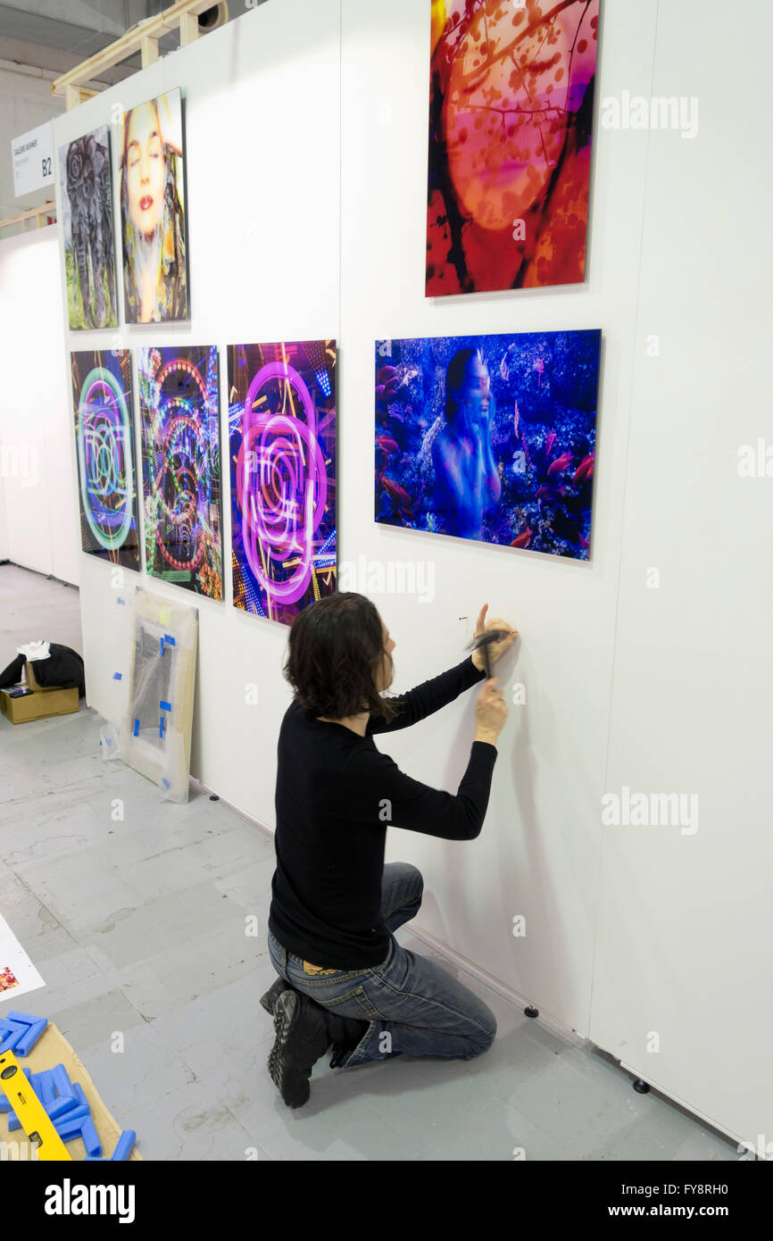 Artist preparing exhibition at art fair Stock Photo - Alamy