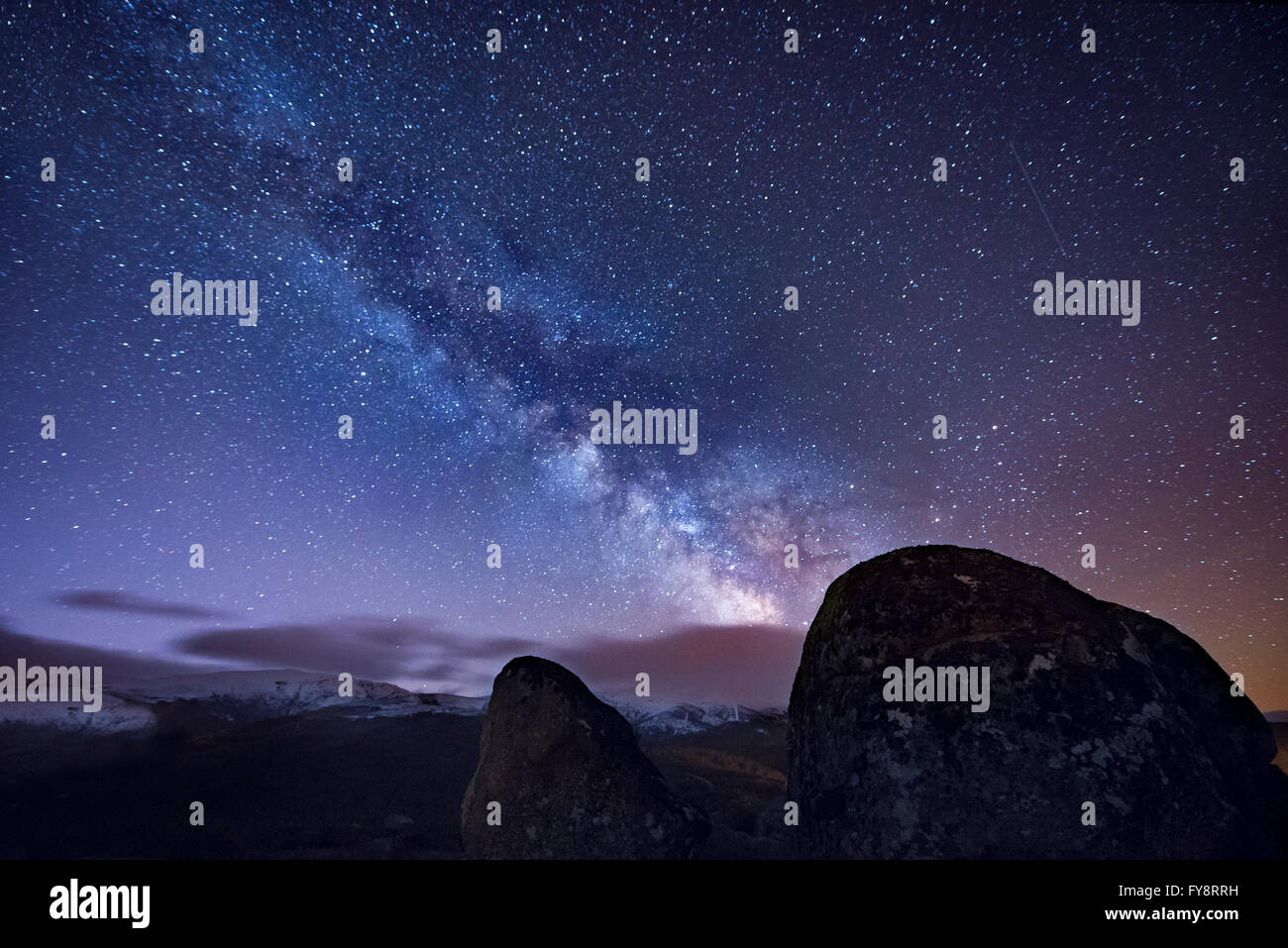 Milky way over ancient granite rocks Stock Photo - Alamy