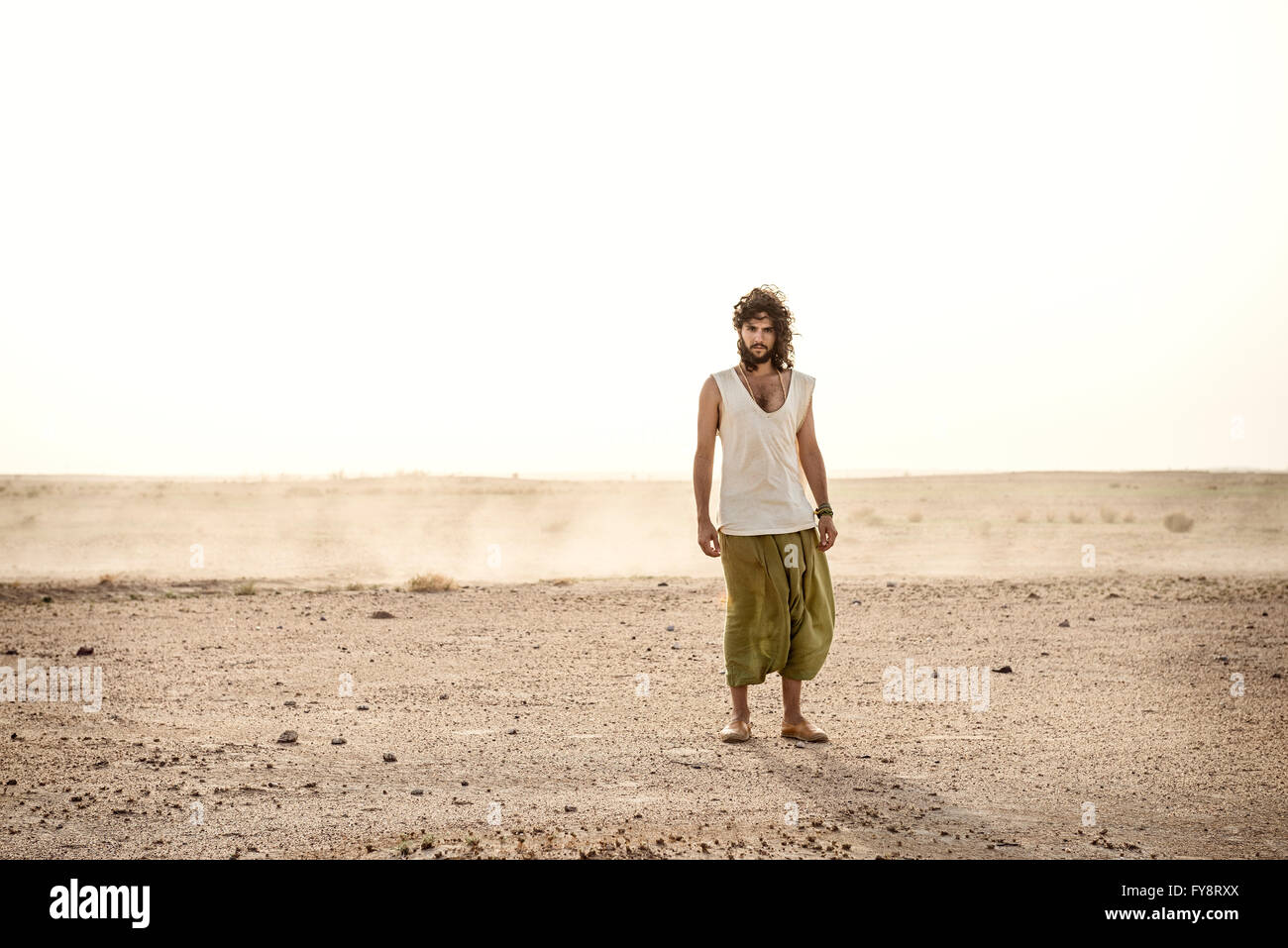 Man standing in the desert alone hi-res stock photography and images ...