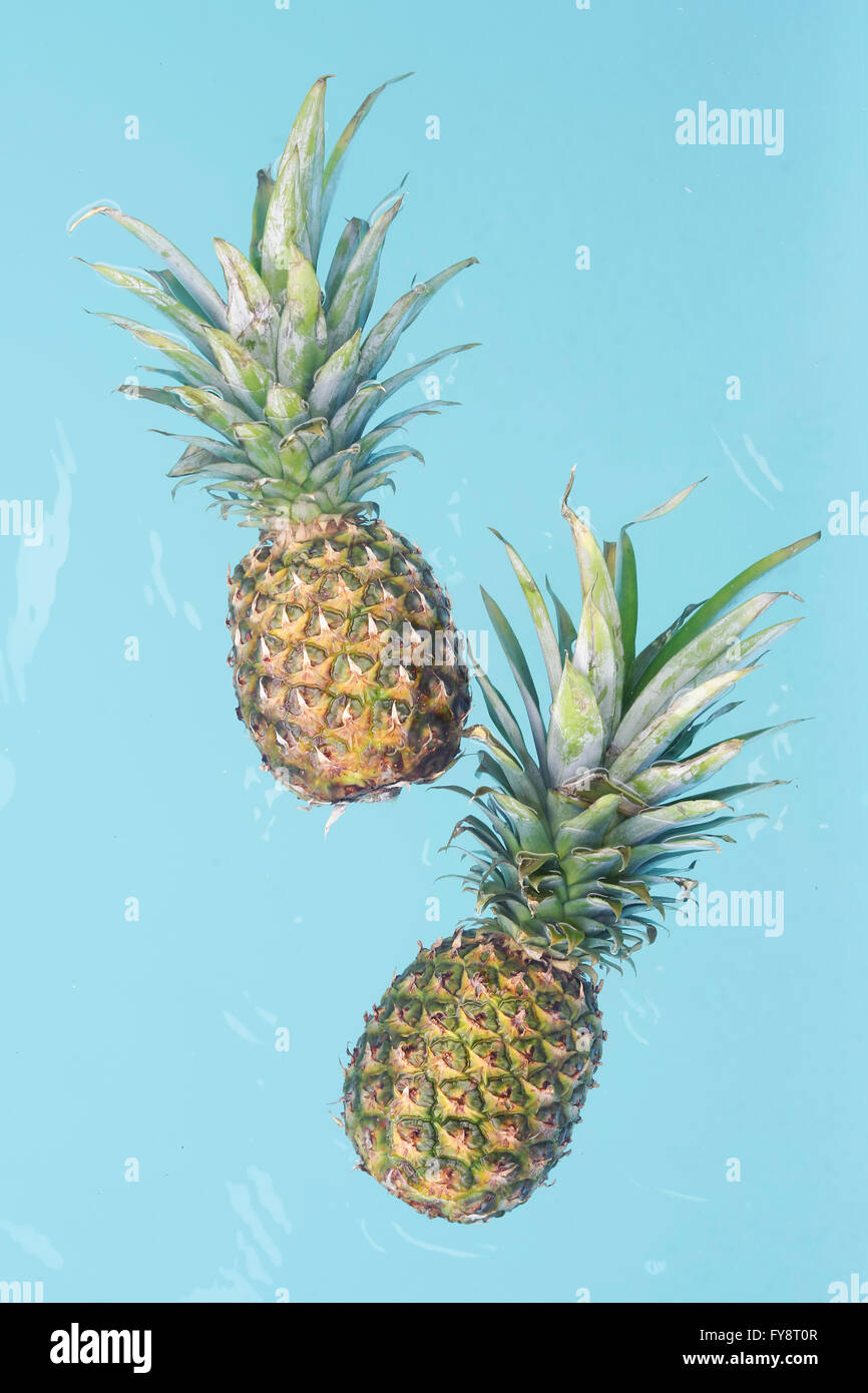 Two pineapples in the pool Stock Photo - Alamy