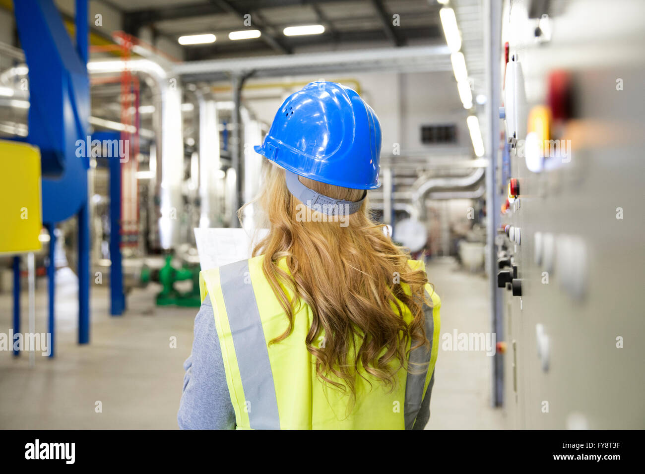 Technician wearing vest helmet hi-res stock photography and images - Alamy