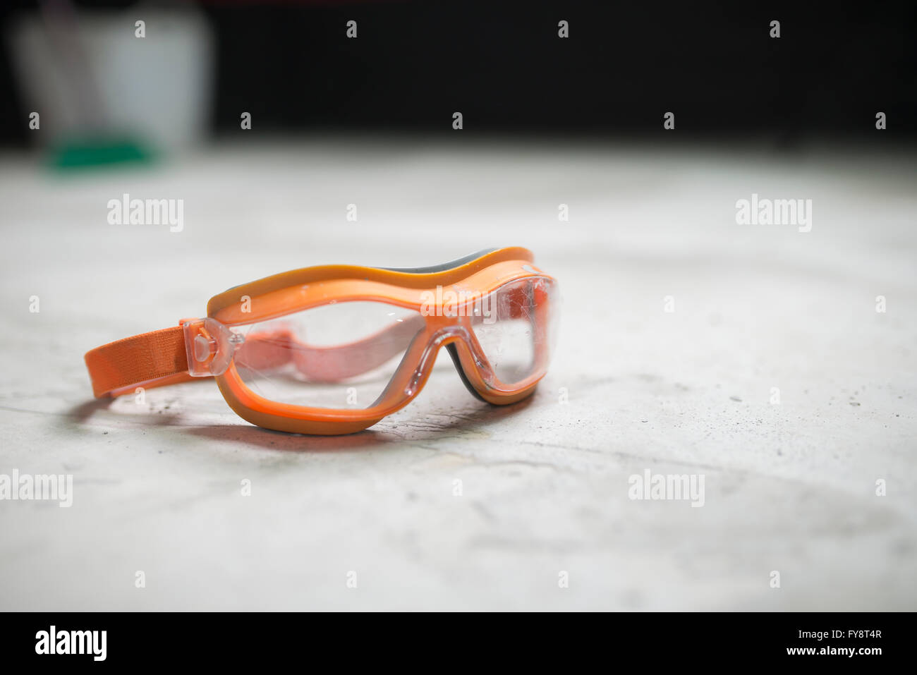 Safety goggles on cement floor Stock Photo - Alamy
