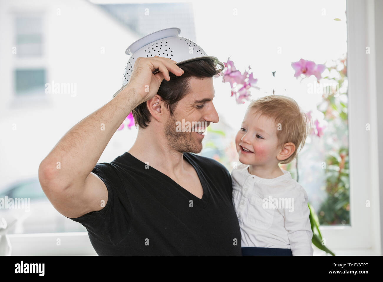 Using colander as hat hi-res stock photography and images - Alamy