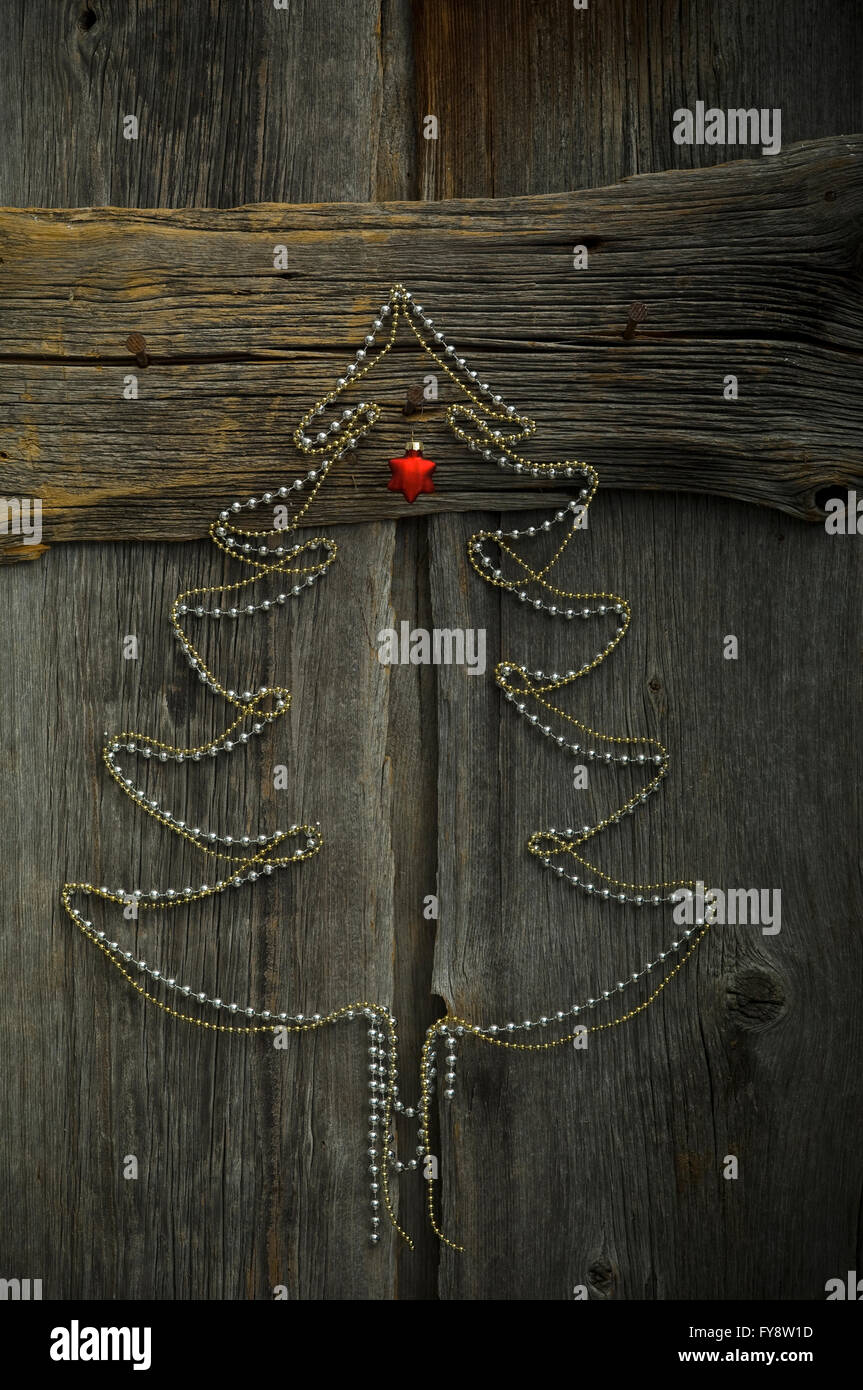 Christmas tree shaped of chains on wood Stock Photo - Alamy