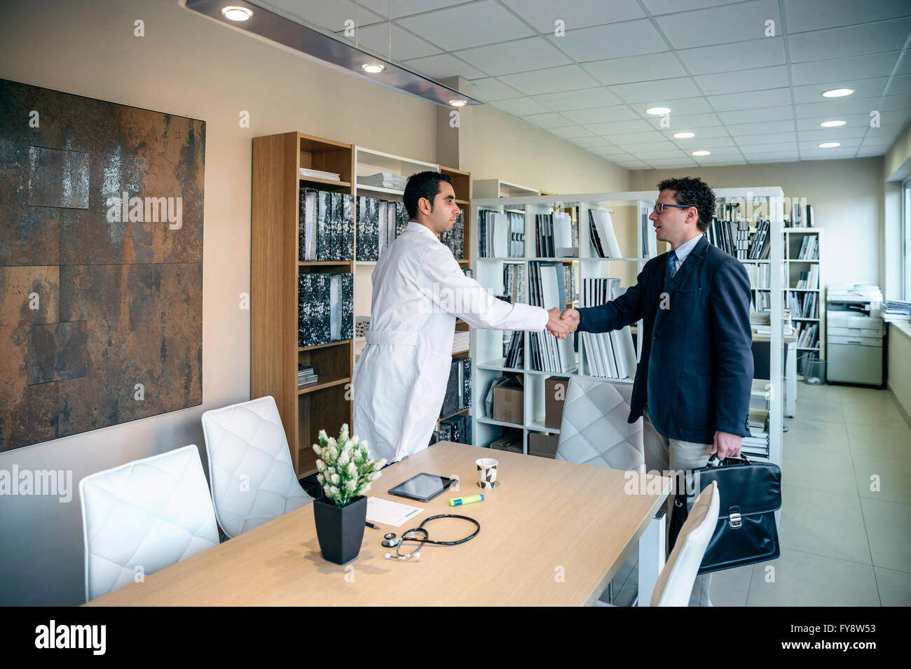 Doctor with man in a suit hi-res stock photography and images - Alamy