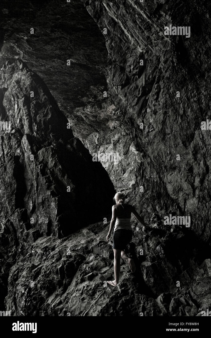 Woman walking in cave hi-res stock photography and images - Alamy