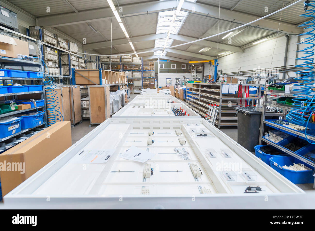 Empty industrial hall with stored packages Stock Photo - Alamy