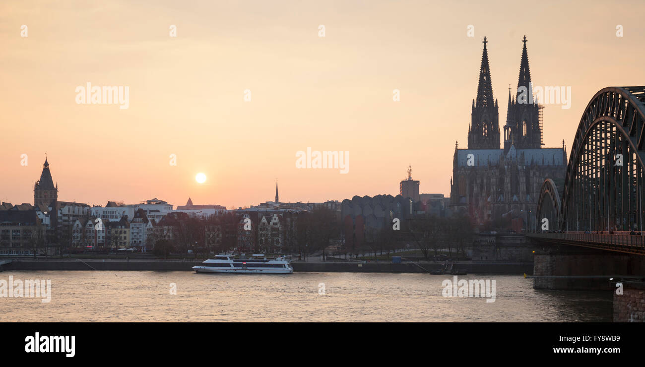 Germany, Cologne, view to the old town and Cologne Cathedral by sunset ...