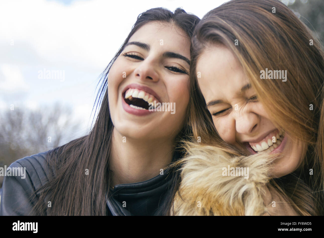 Two laughing young women Stock Photo - Alamy