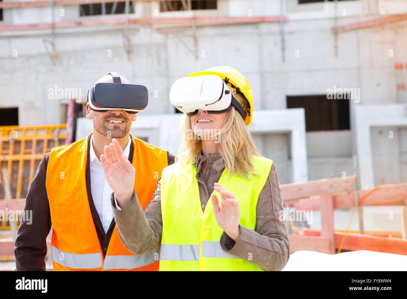 Two persons with Virtual Reality Glasses at construction site Stock ...
