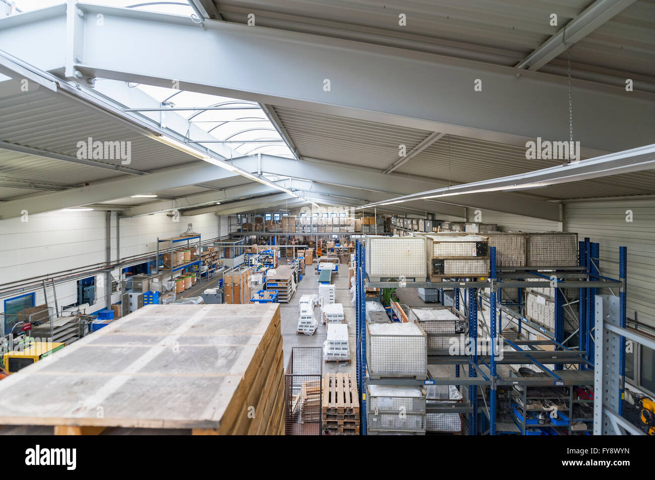 Empty industrial hall with high racks Stock Photo - Alamy