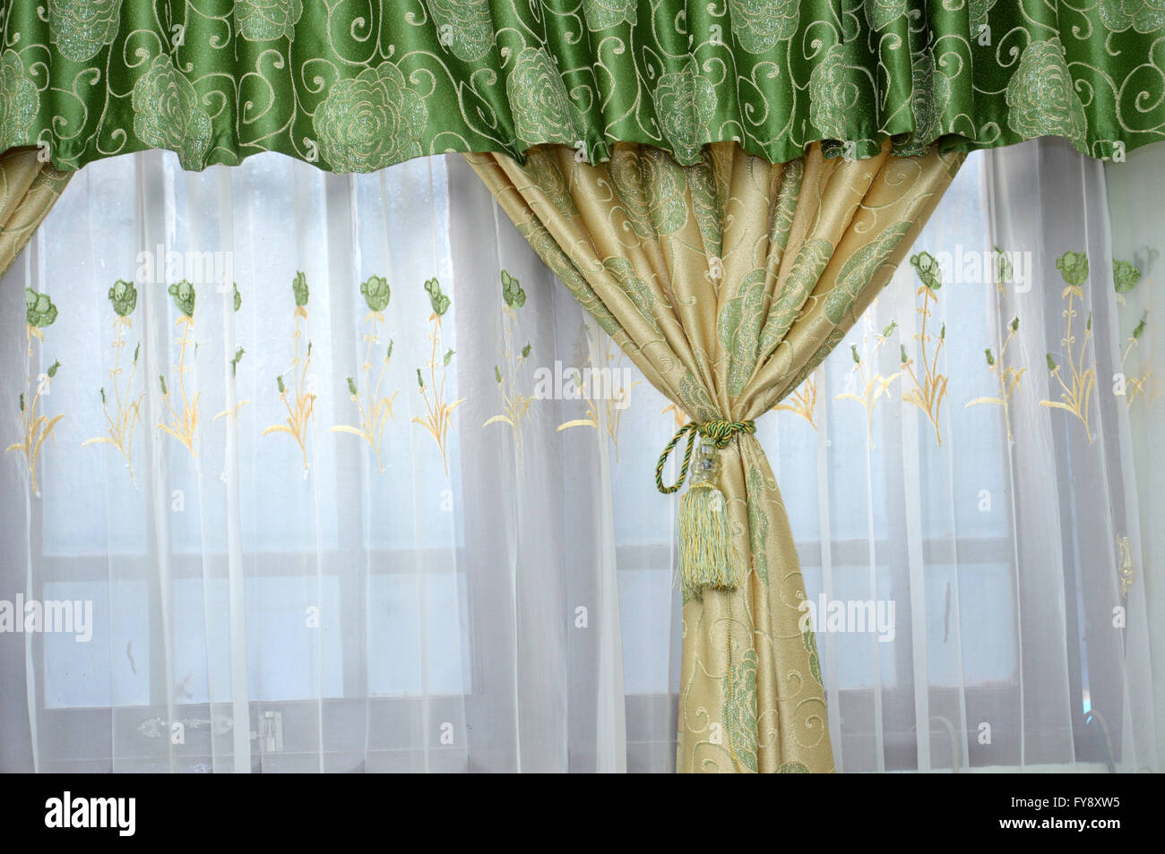 green and gold silk curtain Stock Photo - Alamy