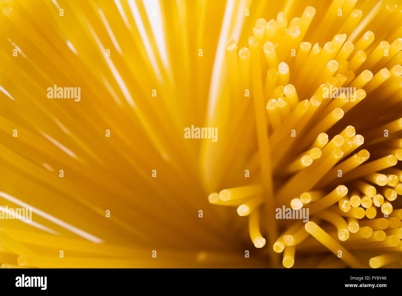 Yellow and beautiful pasta close-up as a background Stock Photo - Alamy
