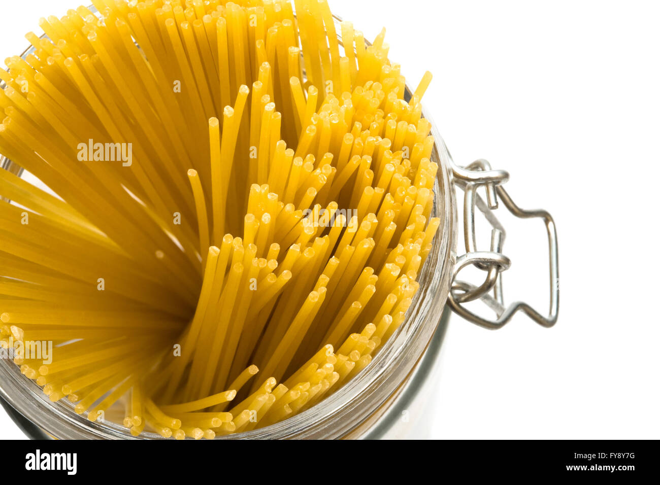 pasta in glass can on a white background Stock Photo - Alamy