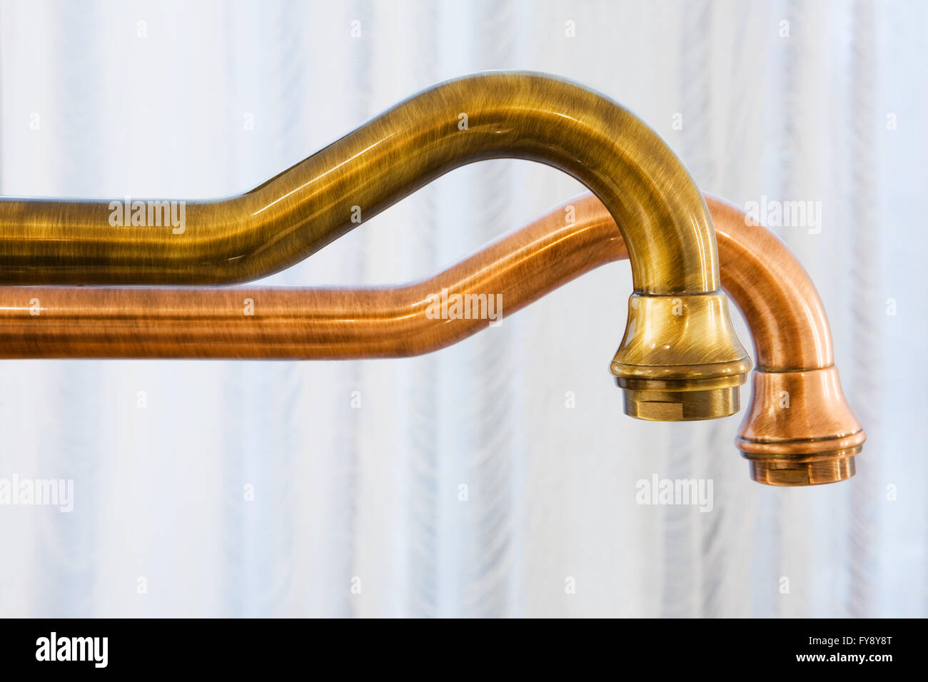 Two beautiful and shining taps cranes close-up Stock Photo - Alamy