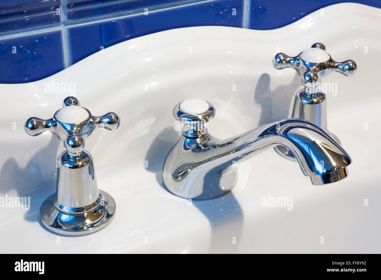 The beautiful and shining tap in a modern bathroom Stock Photo - Alamy