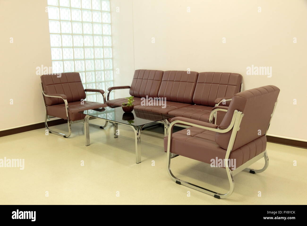 Brown sofa with table and Chair set Stock Photo - Alamy