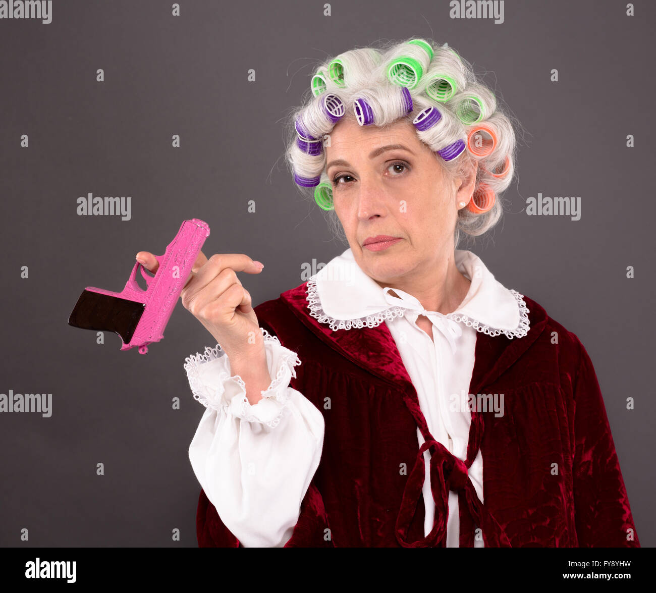 Grandmother with gun Stock Photo - Alamy