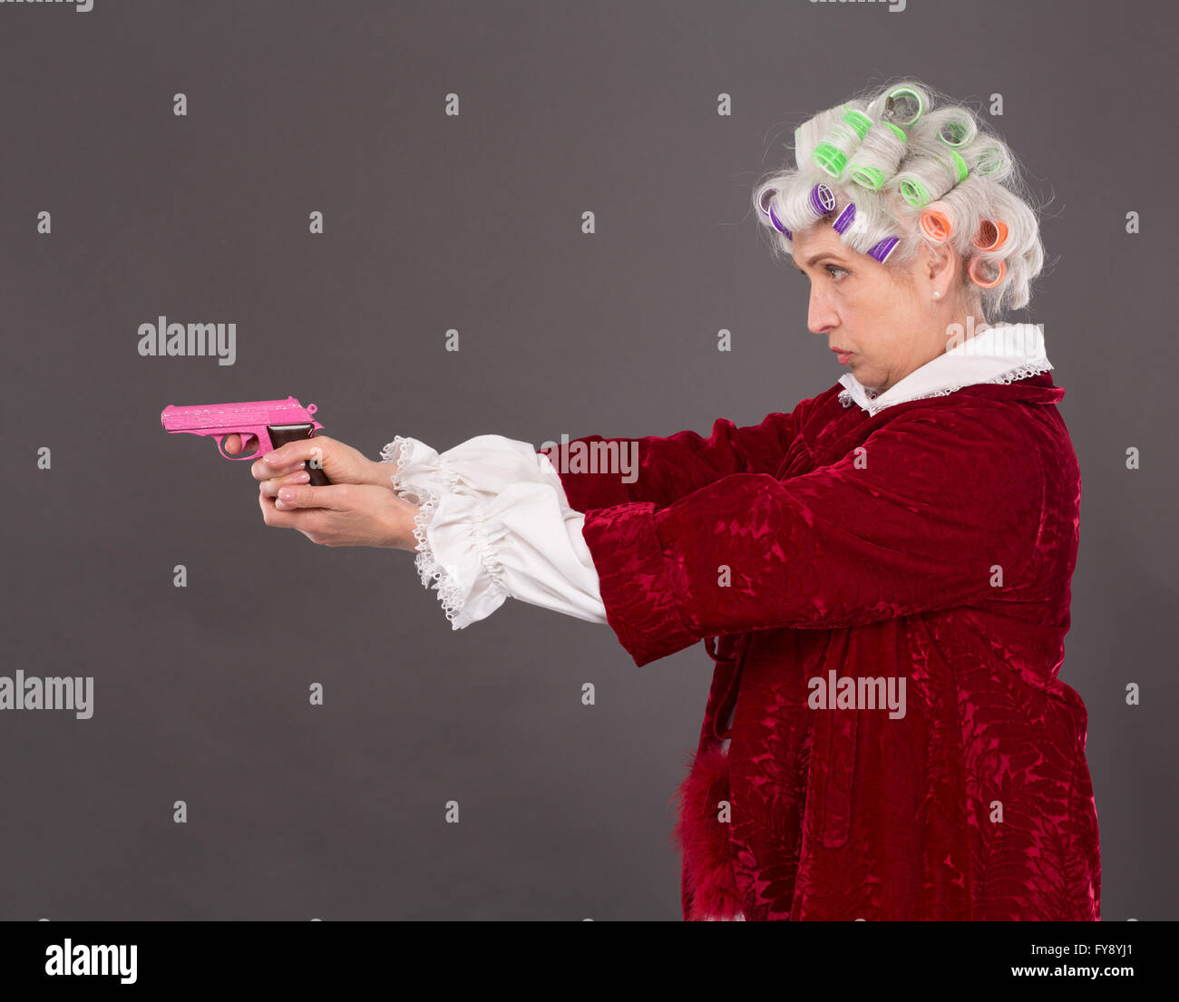 Grandmother with gun Stock Photo - Alamy