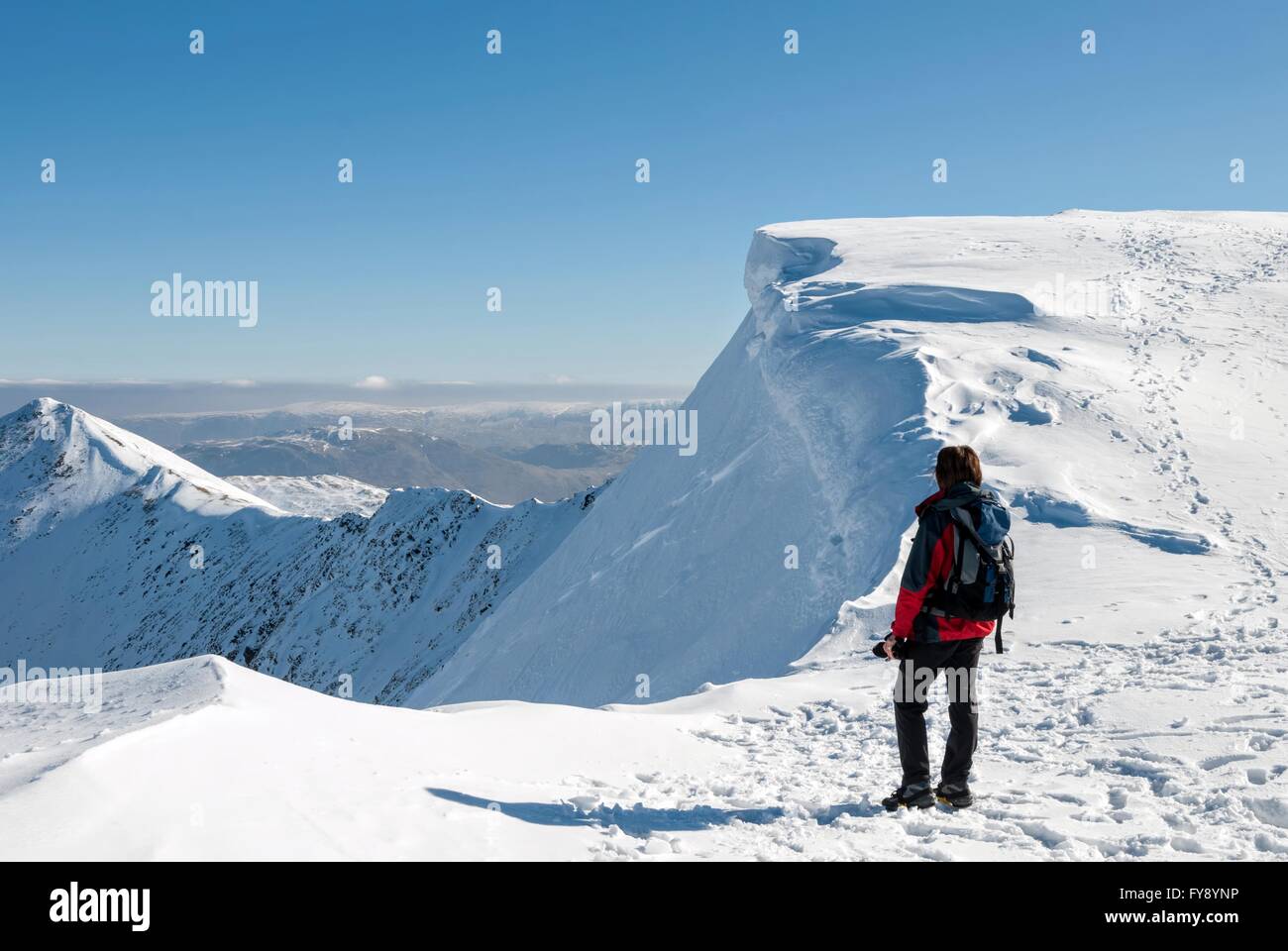 Explorer on mountain behind hi-res stock photography and images - Alamy