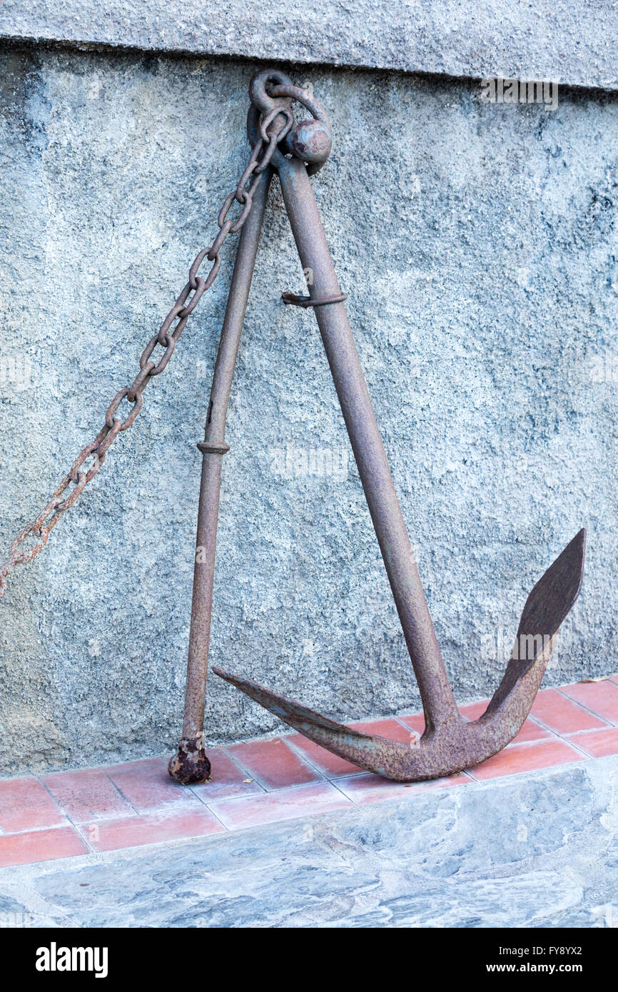 Anchor on a wall with chain Stock Photo - Alamy