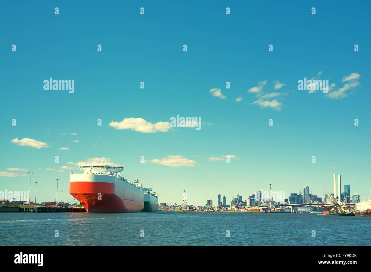 Large cargo ship in Yarra river with Melbourne CBD skyline in the ...