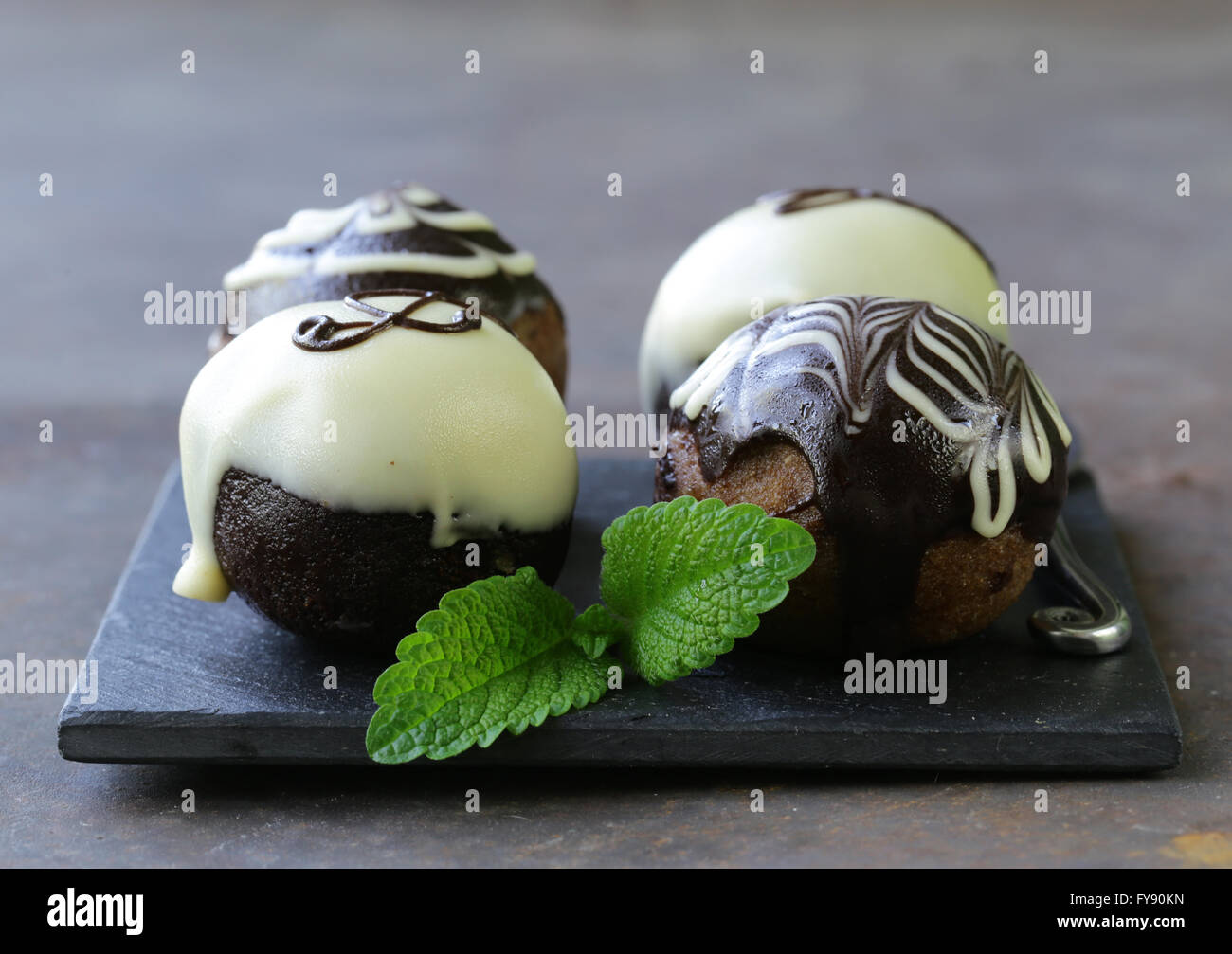 dessert biscuit balls cakes with chocolate icing Stock Photo - Alamy