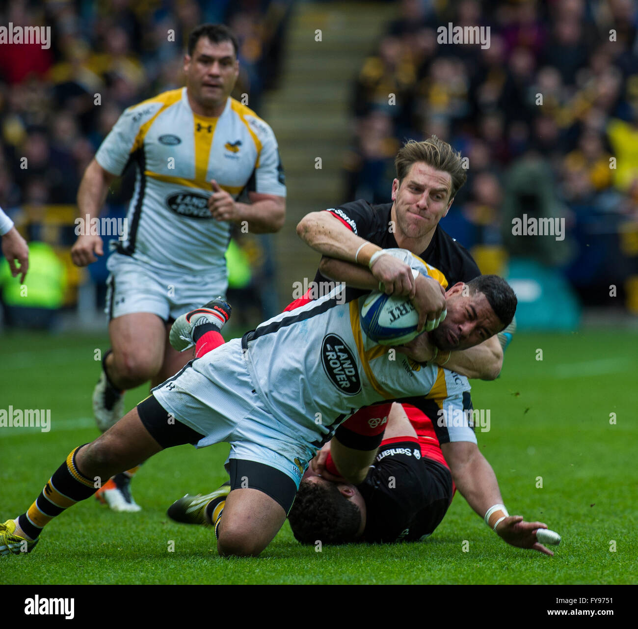 London, UK. 23rd April, 2016. Charles Piutau of Wasps is tackled by ...