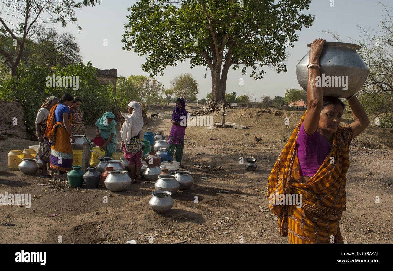 West Bengal, India. 24th Apr, 2016. Indian women collect water from a ...